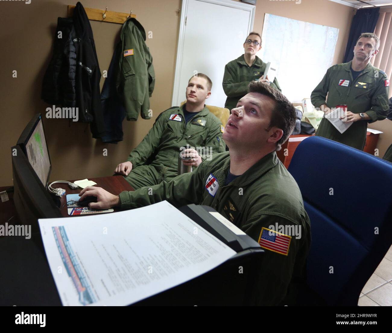 Members of the International Ice Patrol at the pre-flight weather ...
