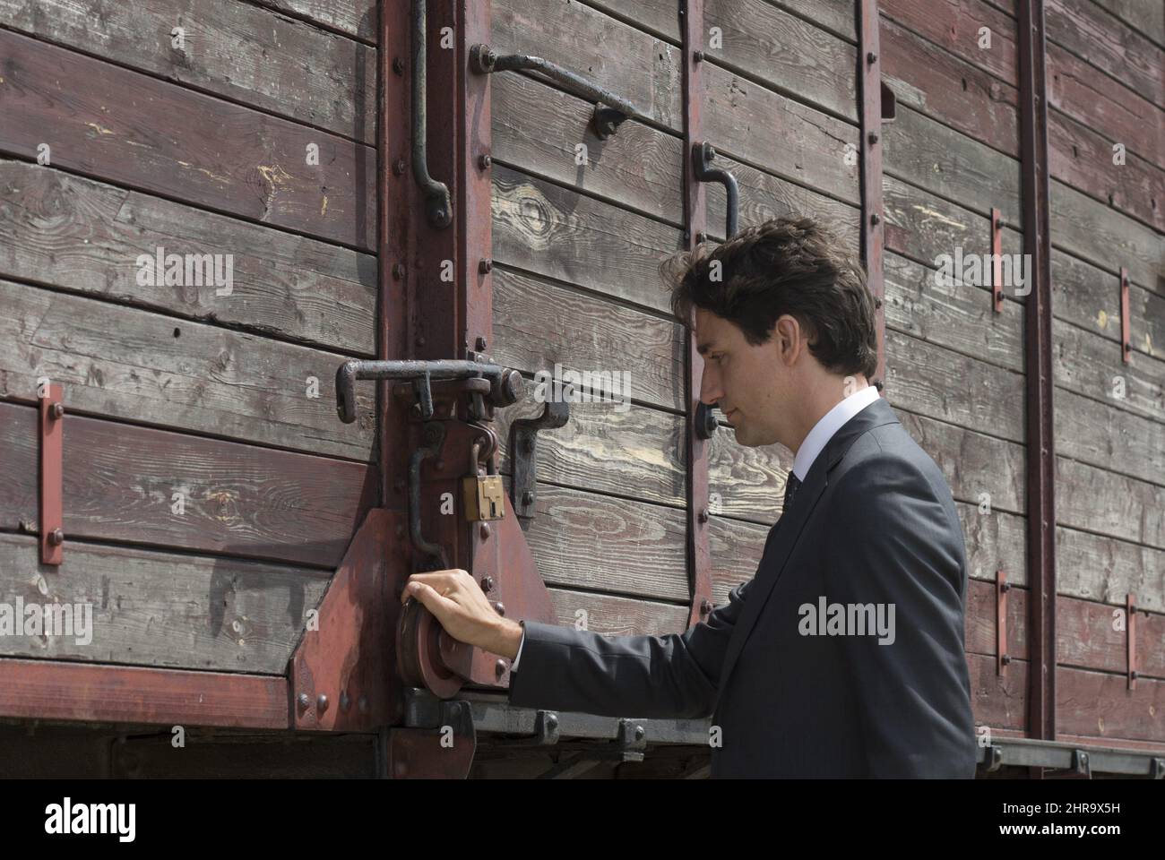 Canadian Prime Minister Justin Trudeau touches a rail car during a tour ...