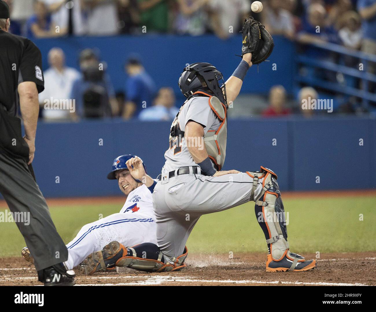Toronto Blue Jays' Justin Smoak scores as Detroit Tigers catcher James ...