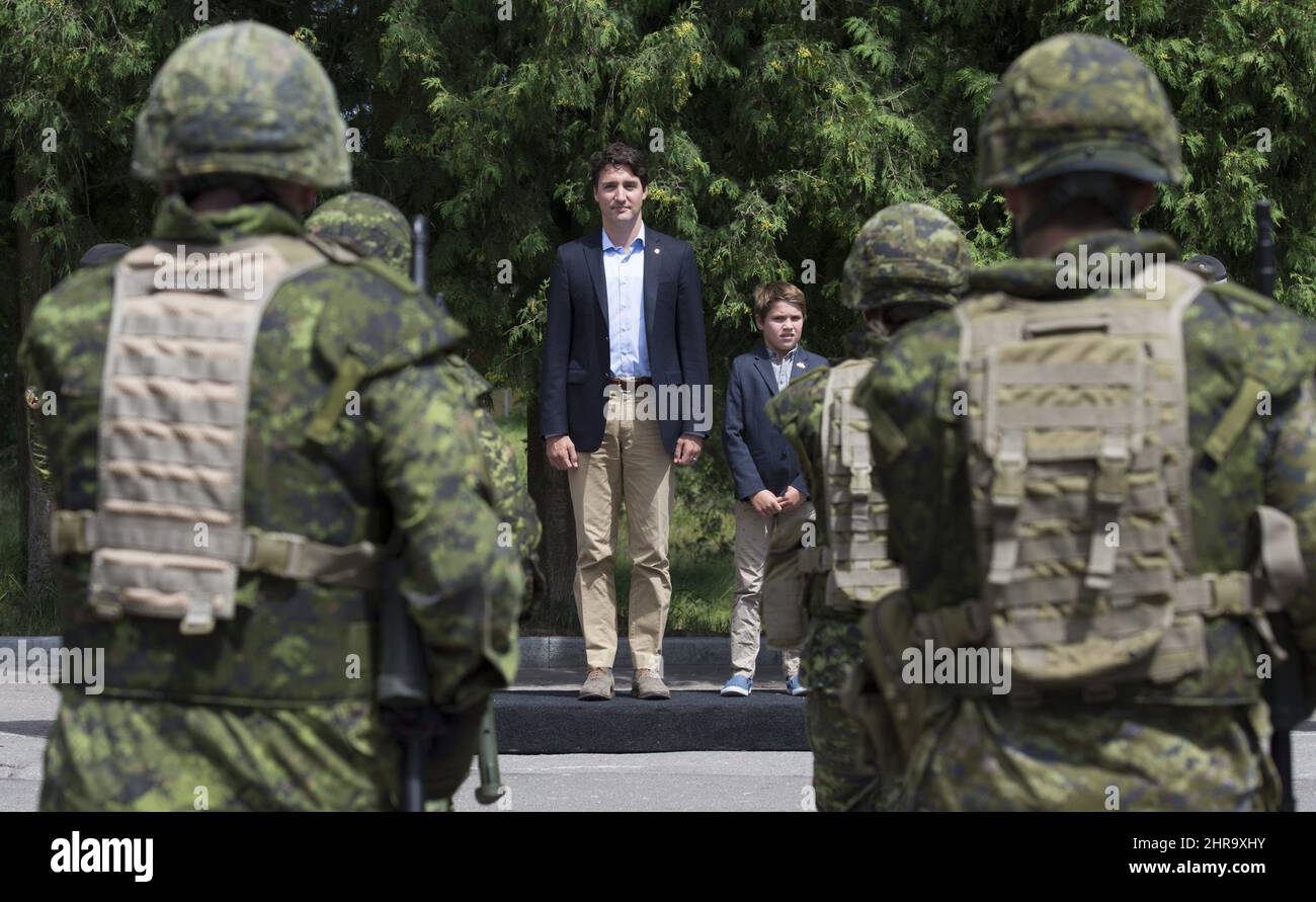 Canadian Prime Minister Justin Trudeau andXavier Trudeau stand on the ...