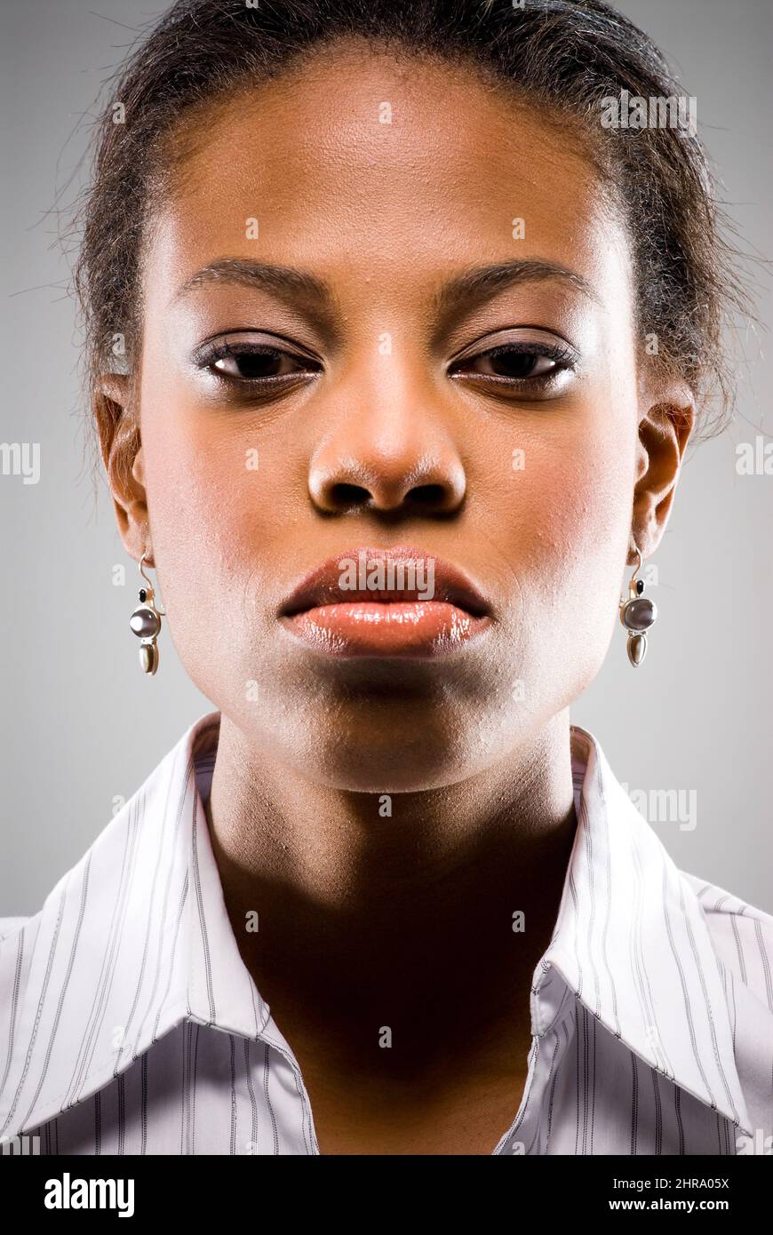 Portrait of stern looking African American woman Stock Photo - Alamy