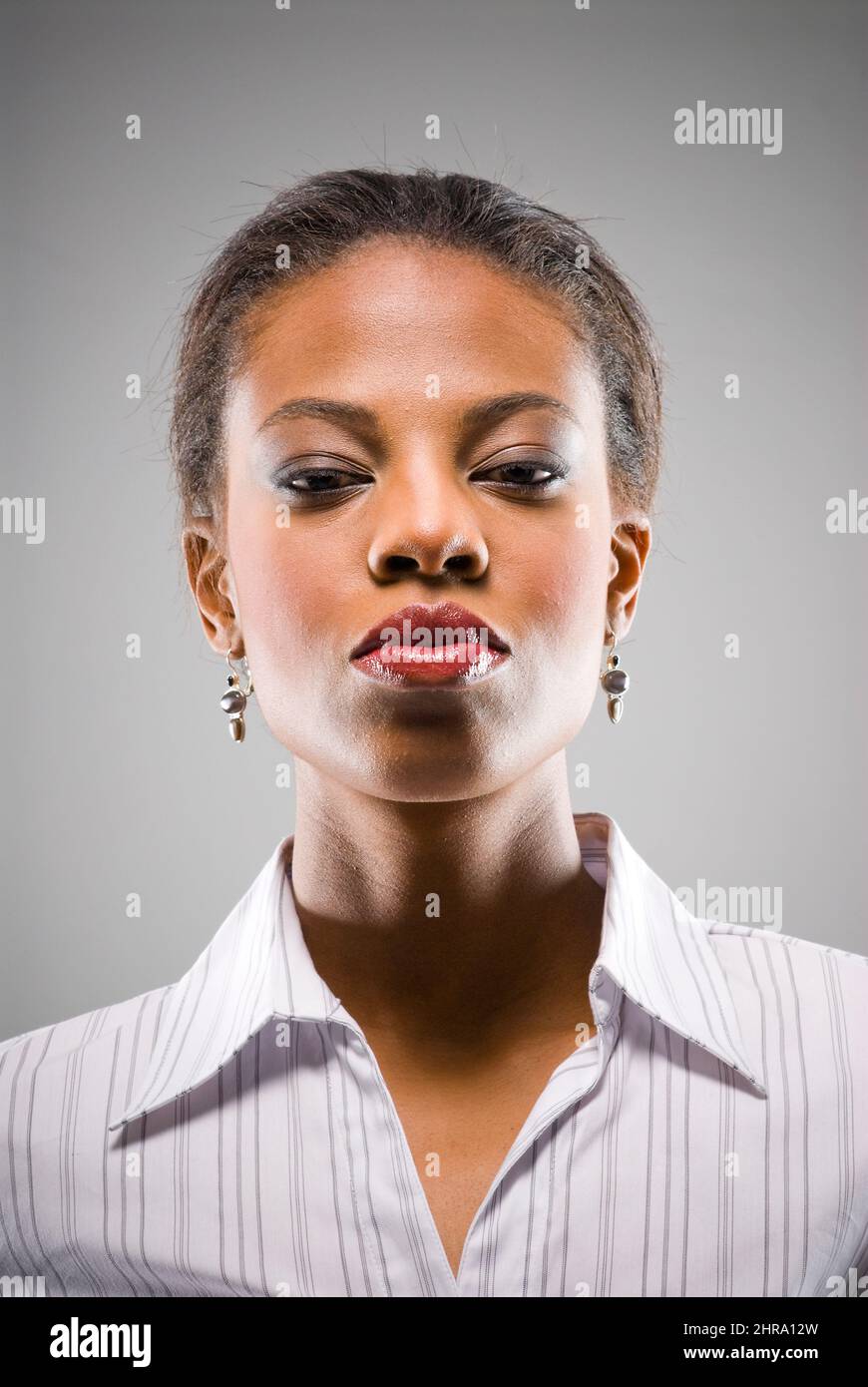 Portrait of stern looking African American woman Stock Photo - Alamy