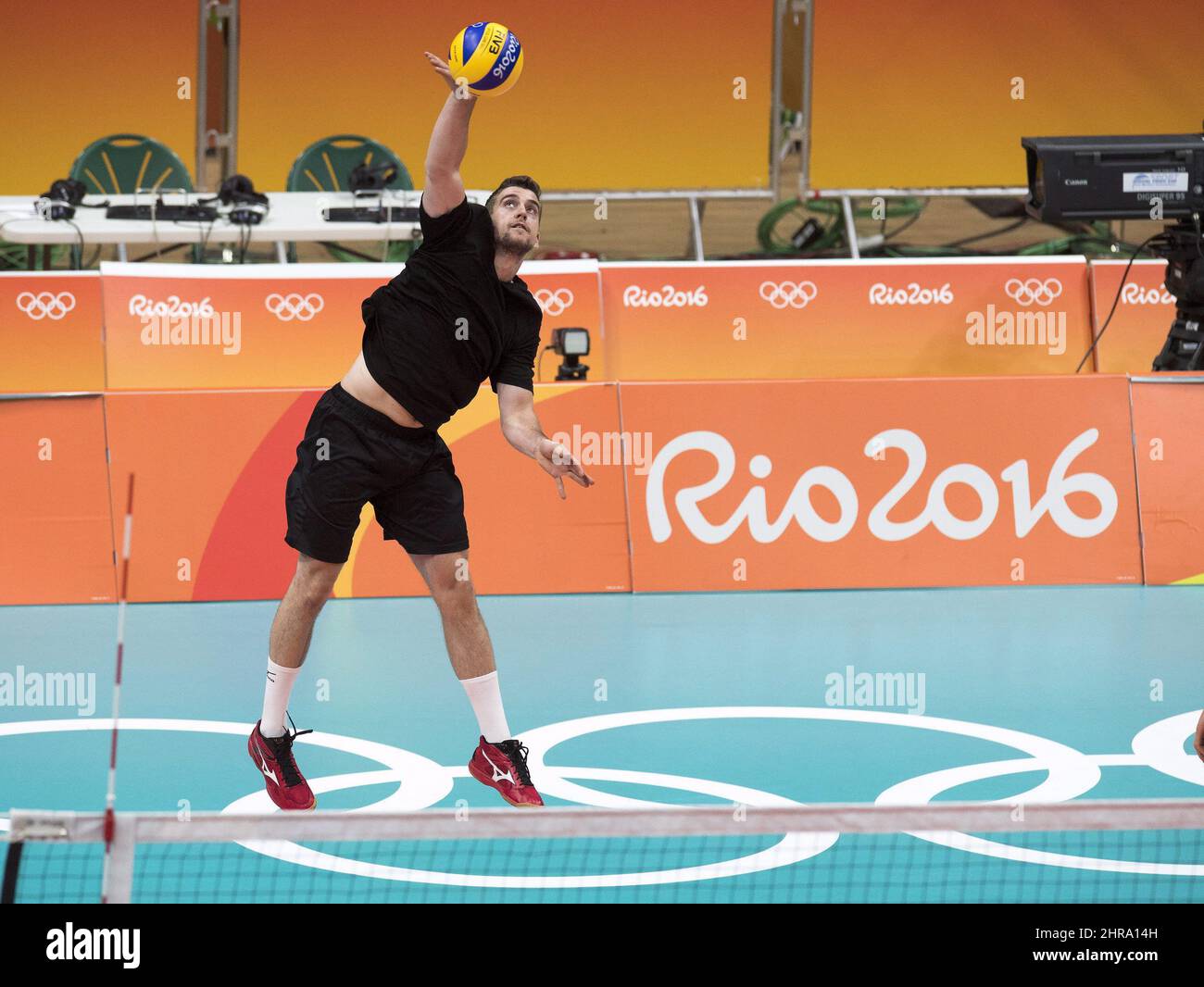 Canadian Olympic men's volleyball team member TJ Sanders serves during ...