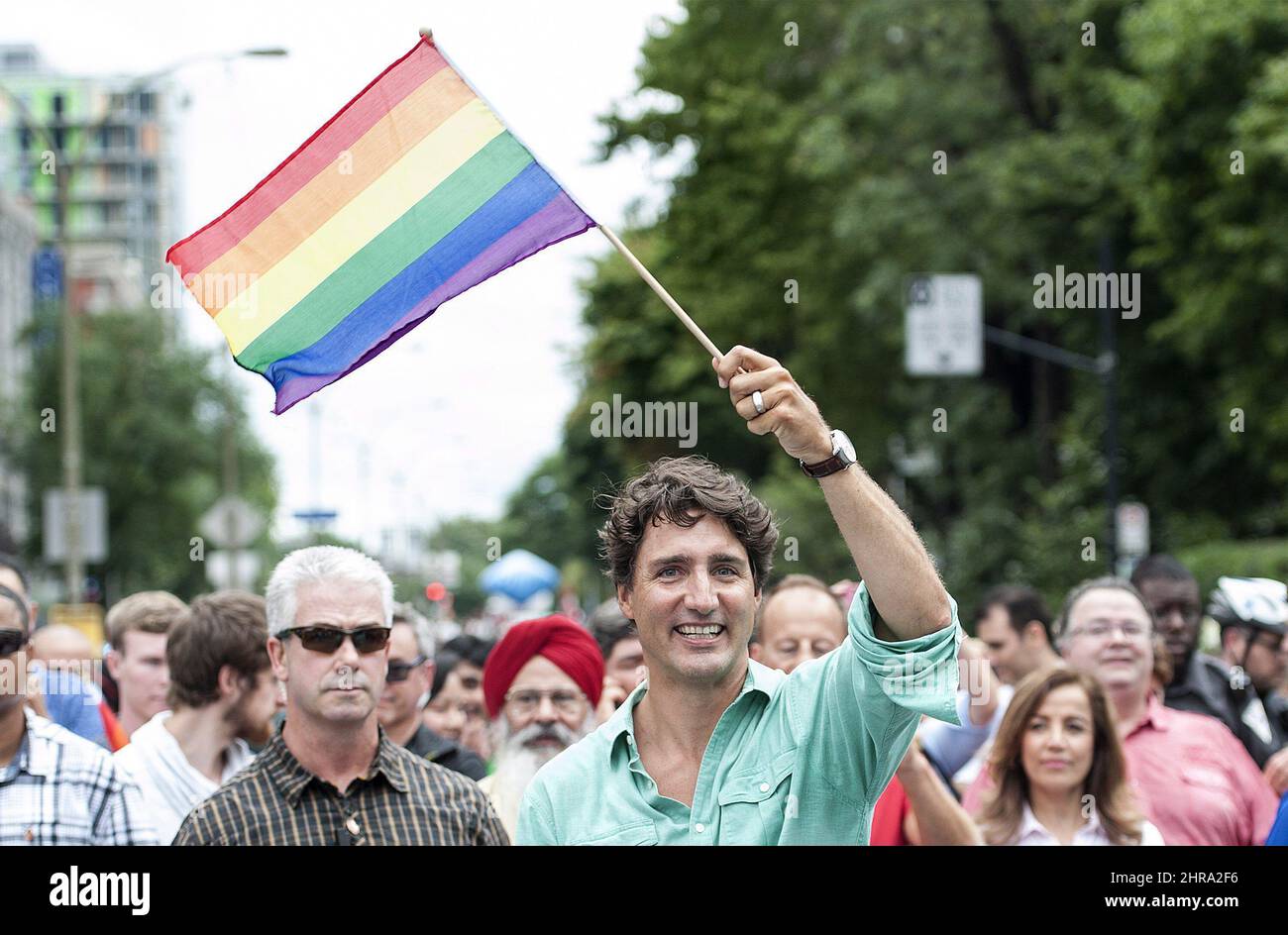 Prime Minister Justin Trudeau waves the rainbow flag as he attends the ...