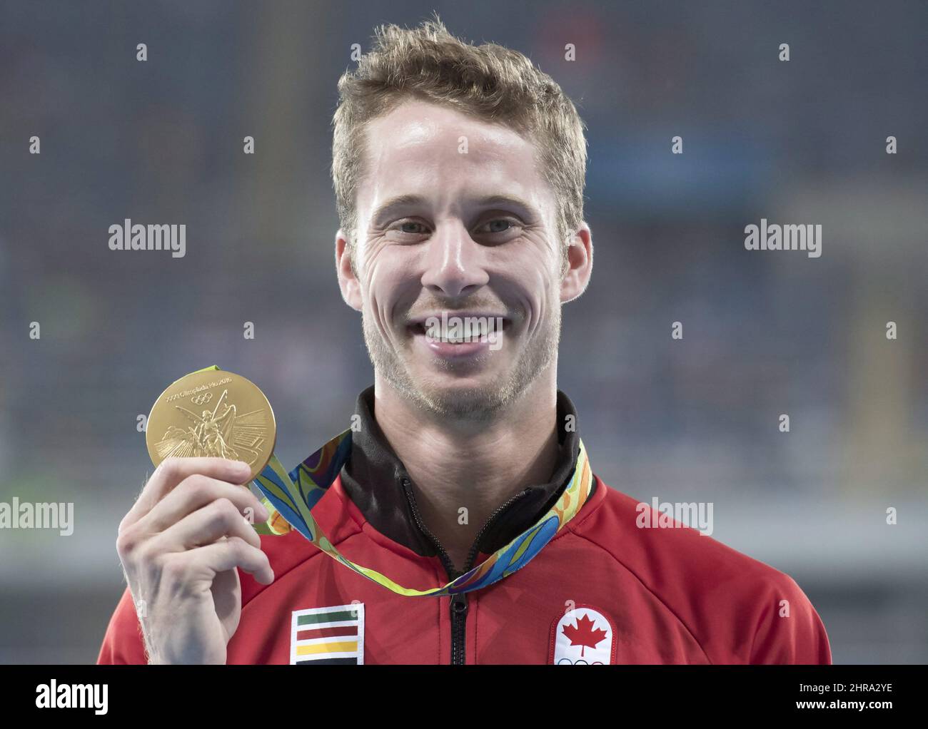 Canada's Derek Drouin shows of his gold medal for high jump at the ...