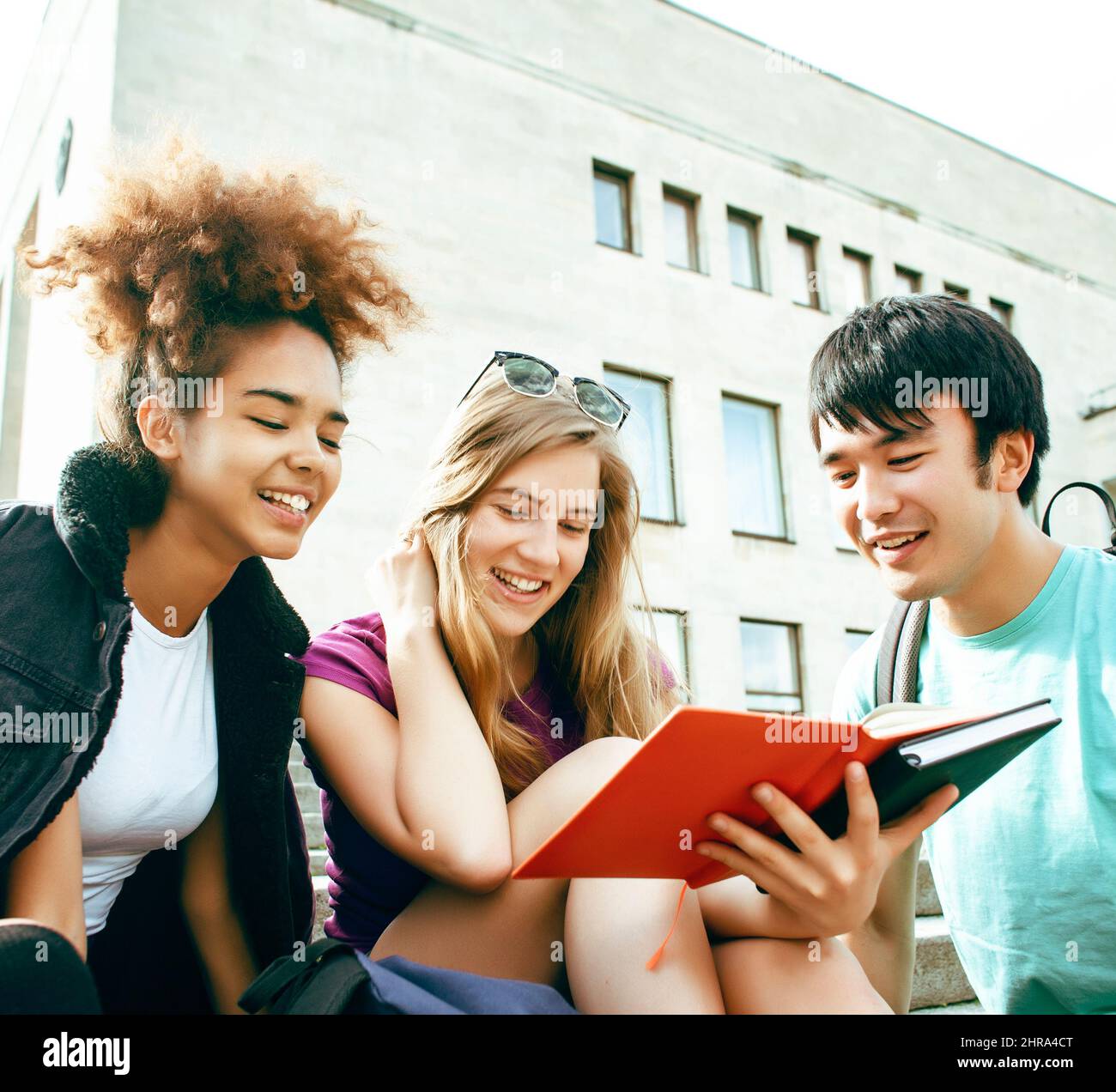 Cute Group Of Teenages At The Building Of University With Books Huggings Diversity Nations
