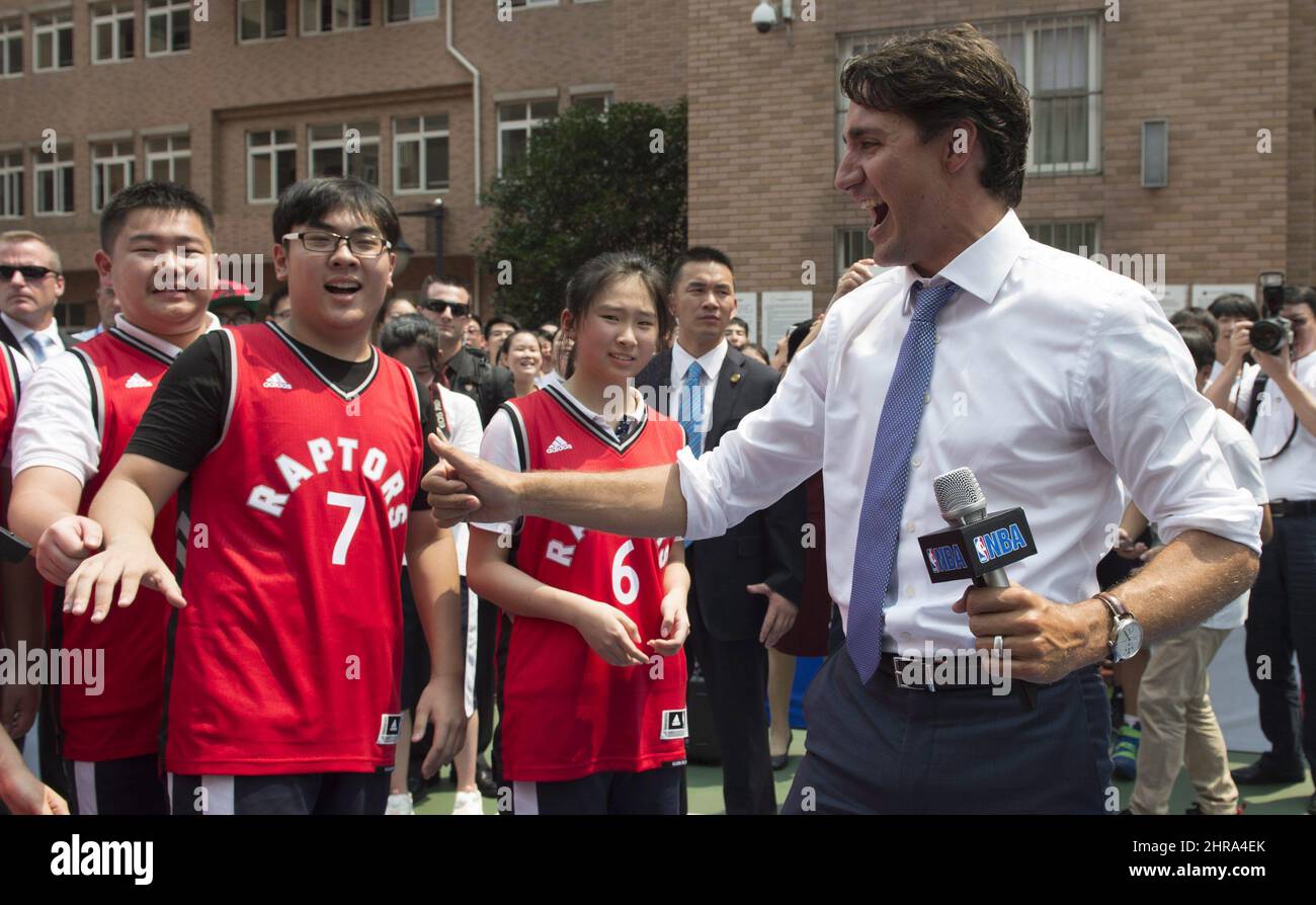 Canadian Prime Minister Justin Trudeau talks with his team as he ...