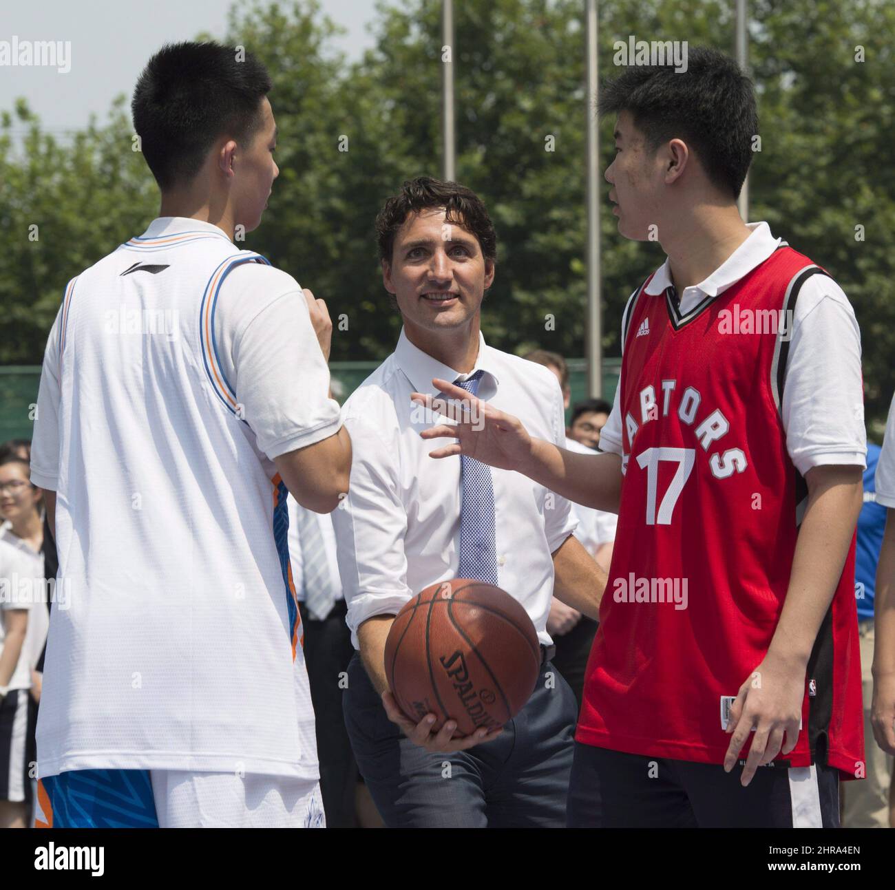 Canadian Prime Minister Justin Trudeau prepares to throw the ball for ...