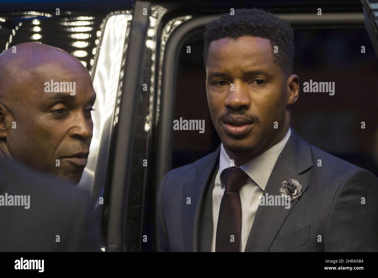 Actor and director Nate Parker (right) arrives on the red carpet for ...