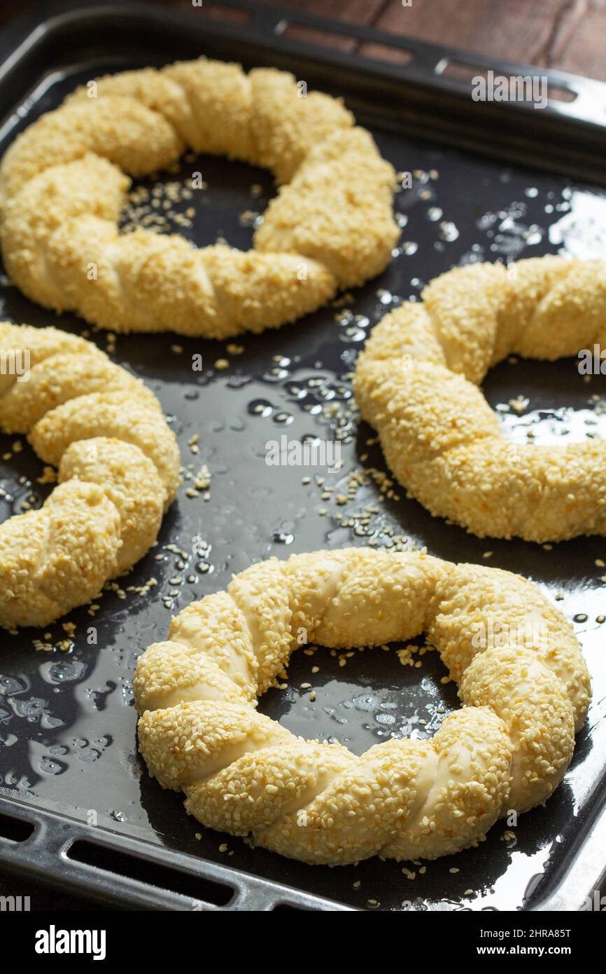 Traditional Turkish sesame simits prepared for baking. Rustic style ...