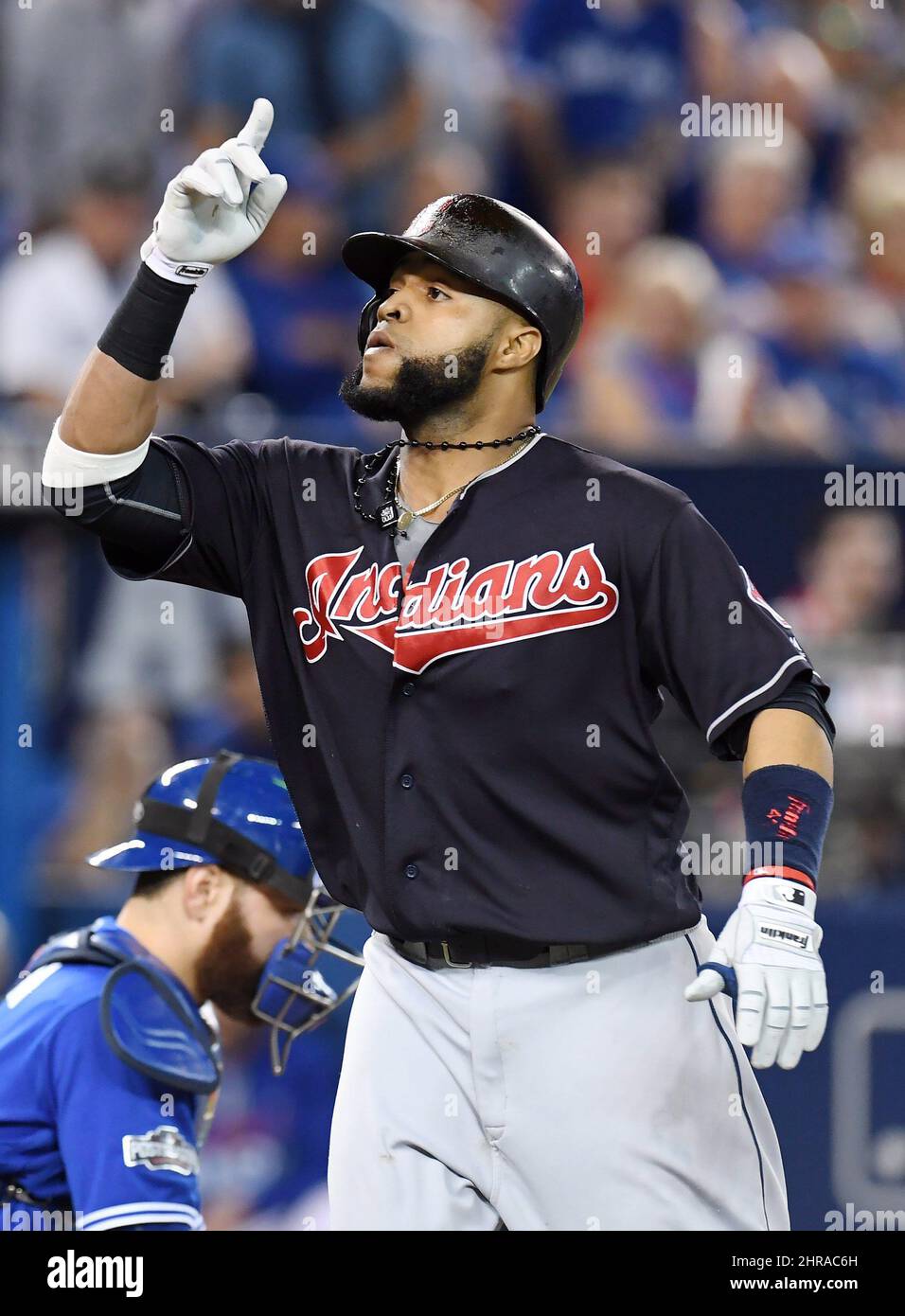 Cleveland Indians first baseman Carlos Santana, right, celebrates with ...