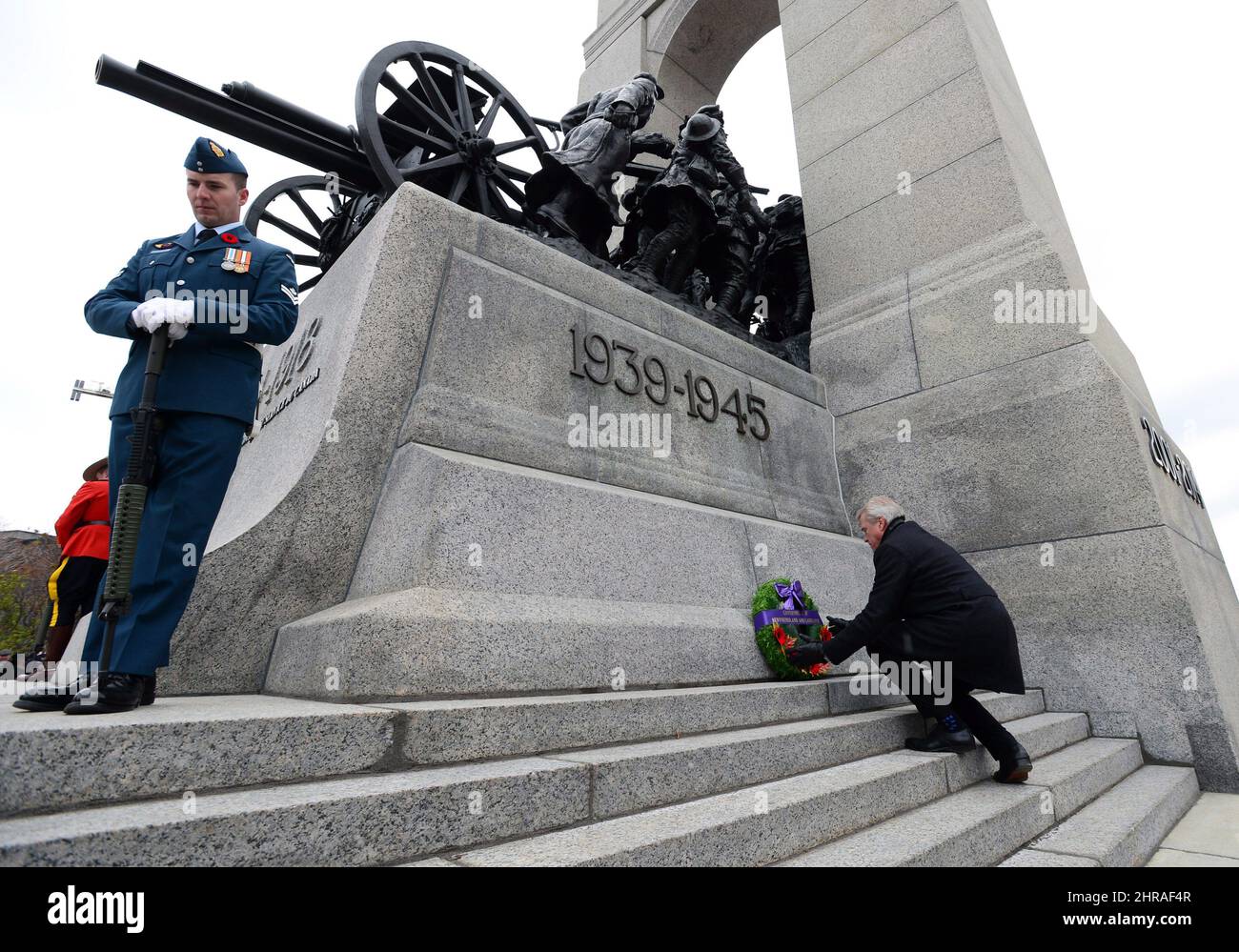 Dwight Ball, Premier of Newfoundland and Labrador, places a wreath ...