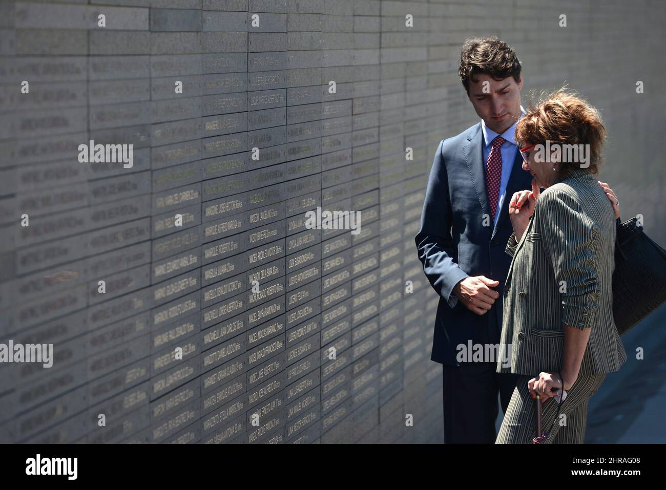Prime Minister Justin Trudeau comforts Nora Patrich, of Vancouver, as ...