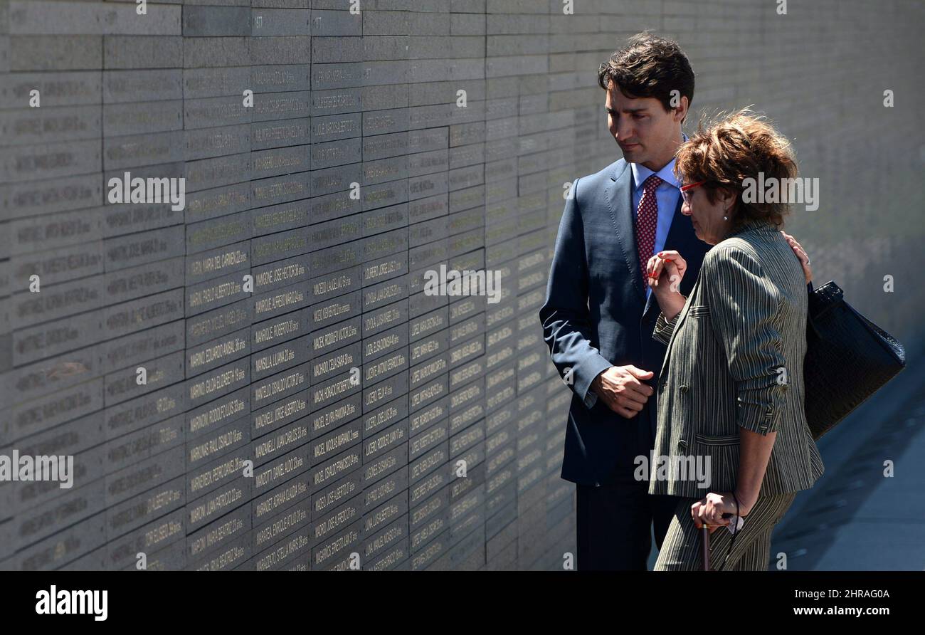 Prime Minister Justin Trudeau comforts Nora Patrich, of Vancouver, as ...