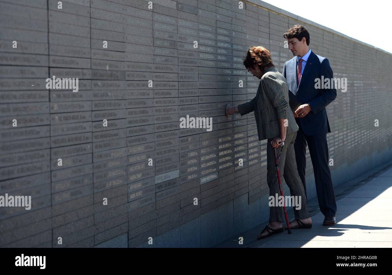 Prime Minister Justin Trudeau comforts Nora Patrich, of Vancouver, as ...