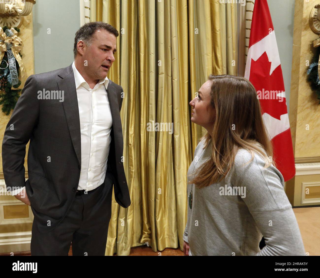 Retired NHL hockey player Eric Lindros chats with Olympic trampolinist ...