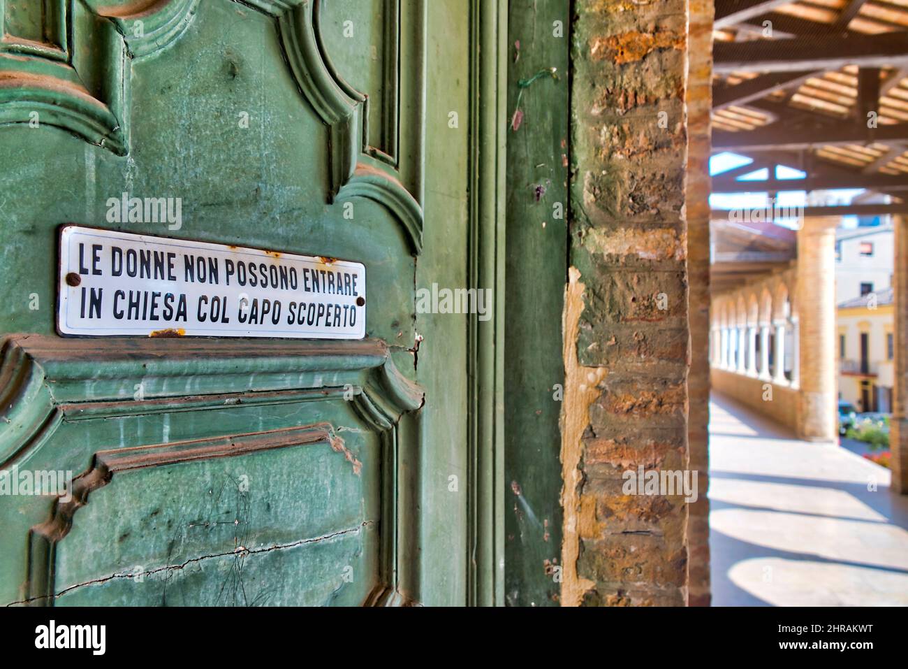 A sign saying "Women cannot enter with their heads uncovered" on the ...