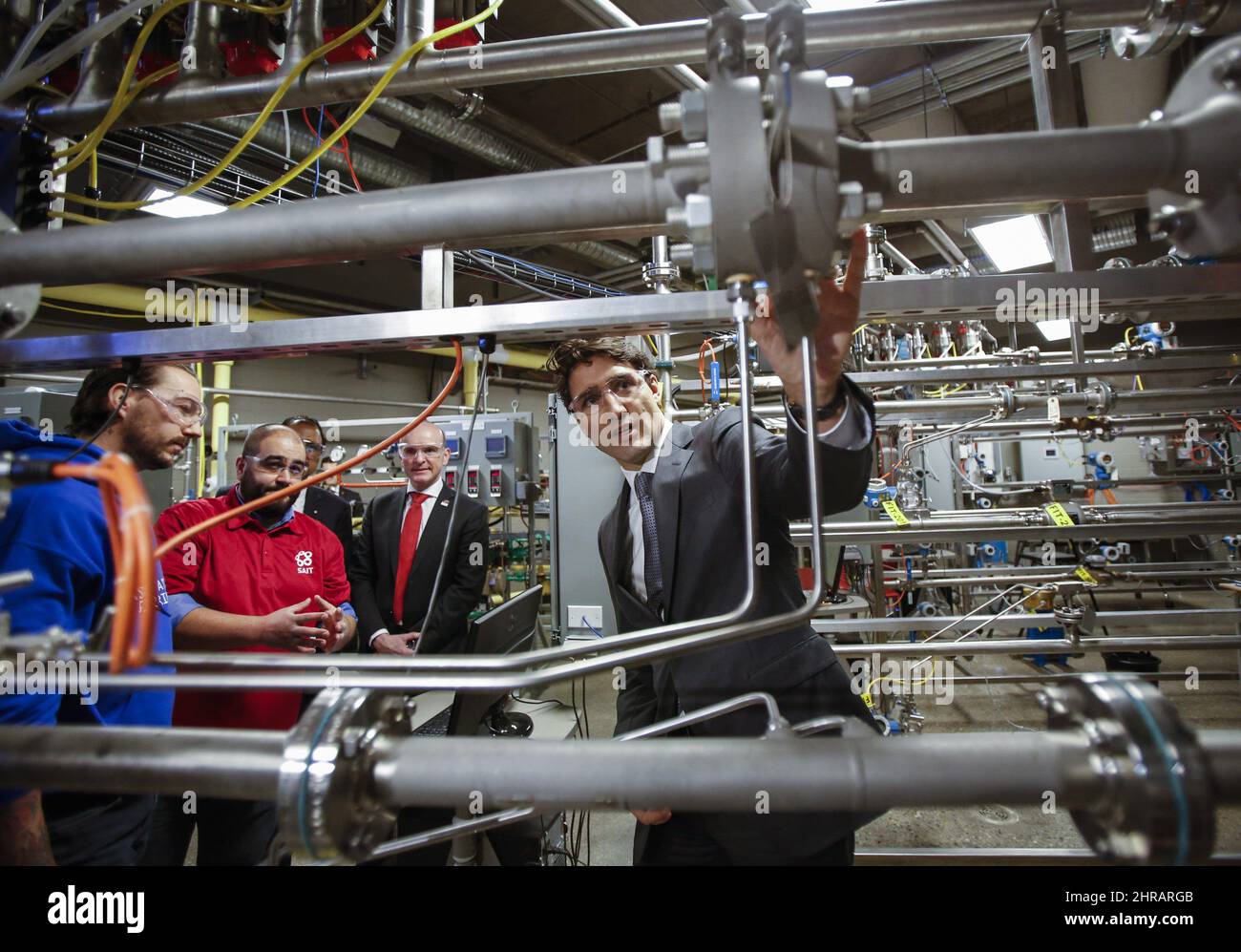 Prime Minister Justin Trudeau, right, listens as Craig Lawson MacKenzie ...