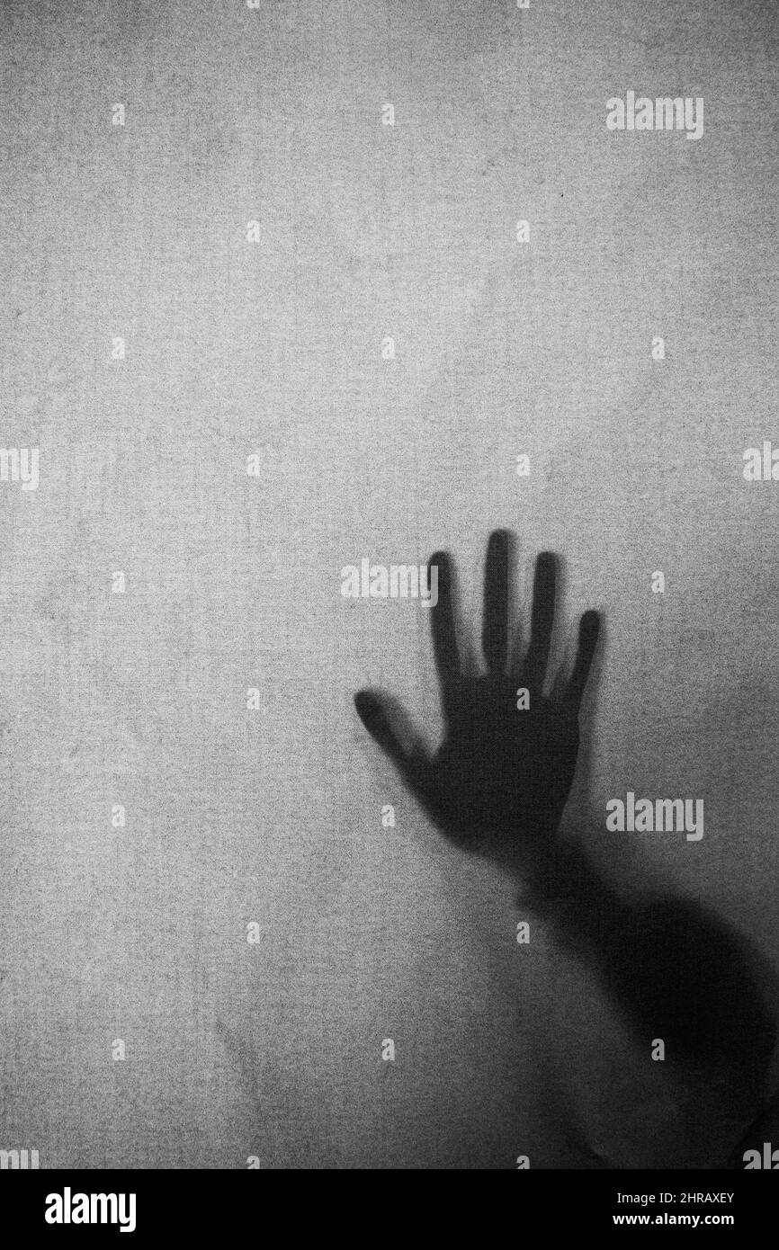 A man hand behind frosted glass in black and white Stock Photo - Alamy