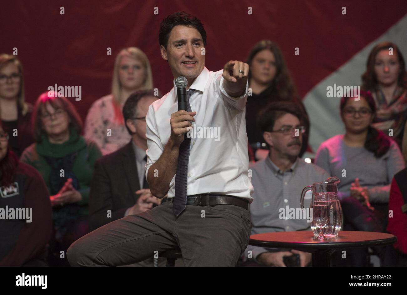 Prime Minister Justin Trudeau points to a member of the audience during ...