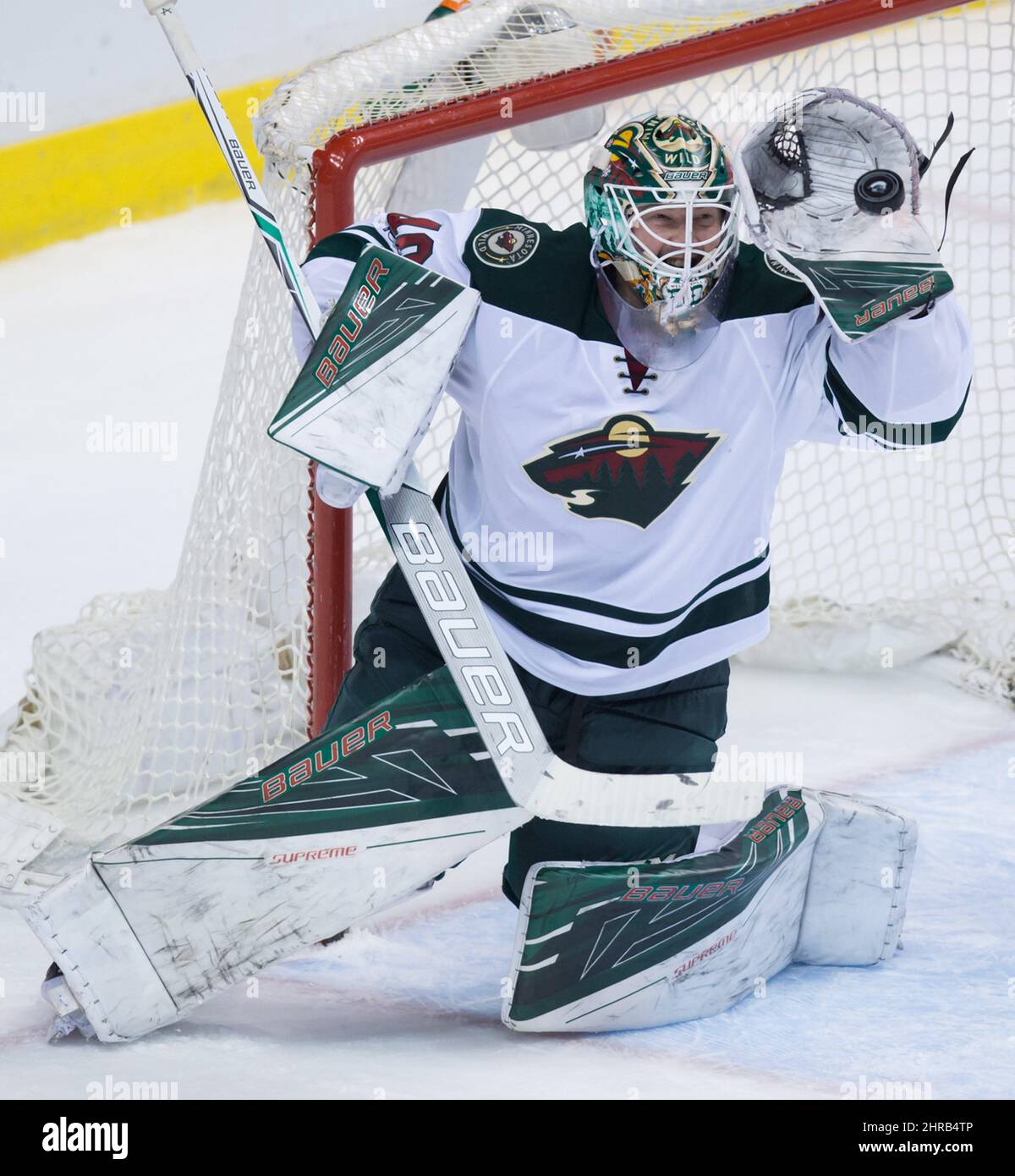 Minnesota Wild goalie Devan Dubnyk makes a glove save during third ...