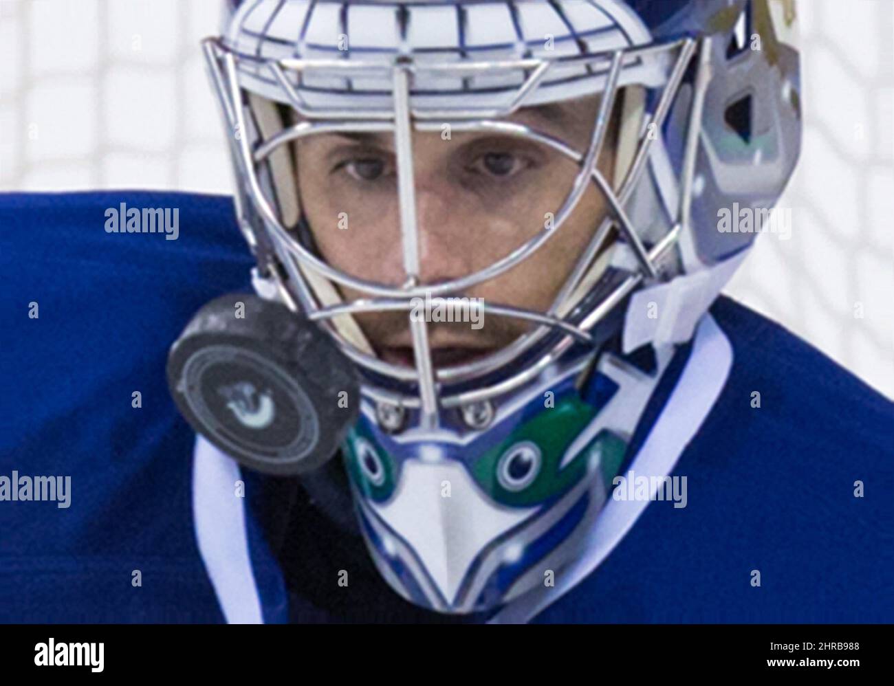 Vancouver Canucks' goalie Ryan Miller watches the puck after making a ...