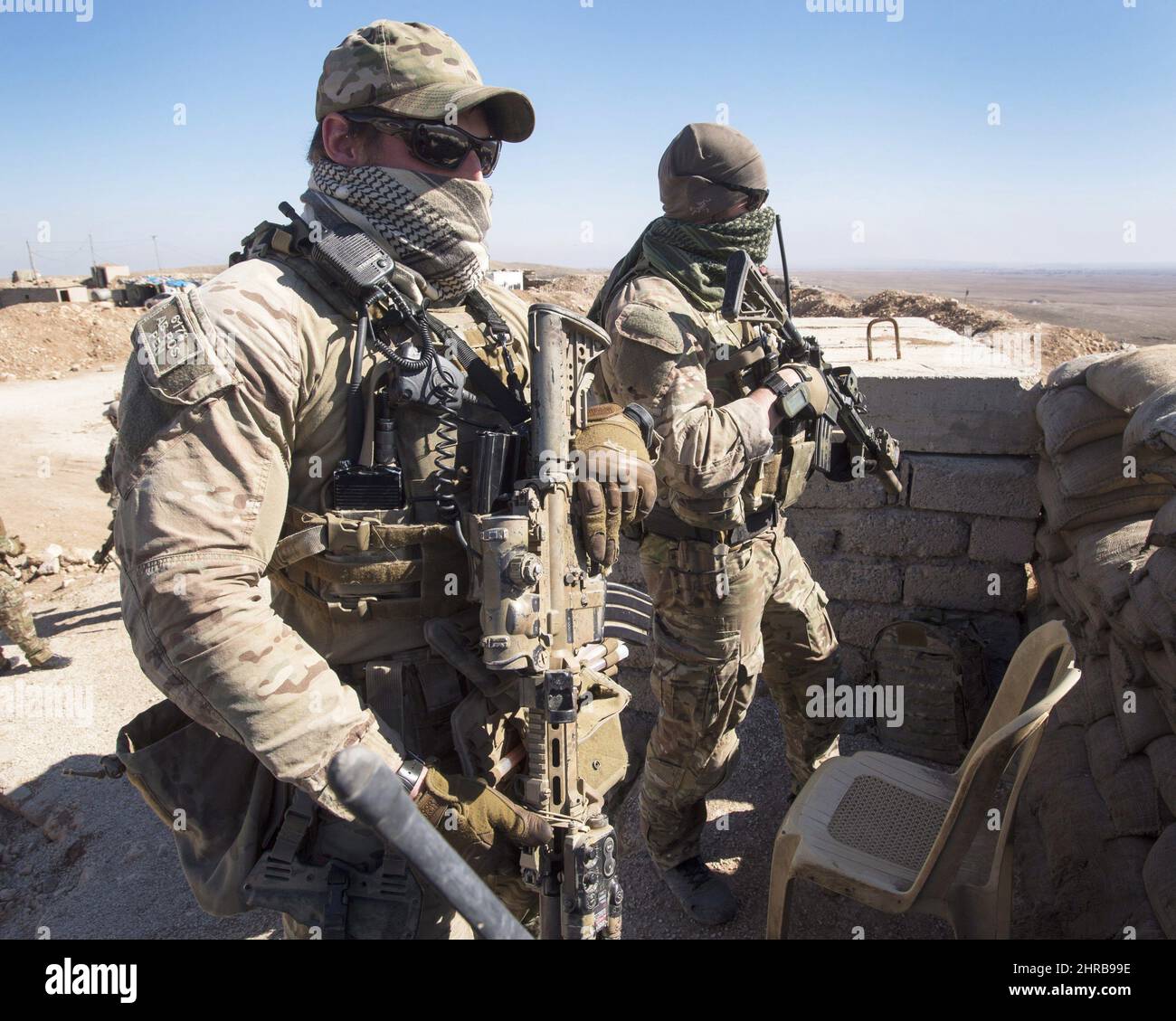 Canadian special forces look over a Peshmerga observation post, Monday ...