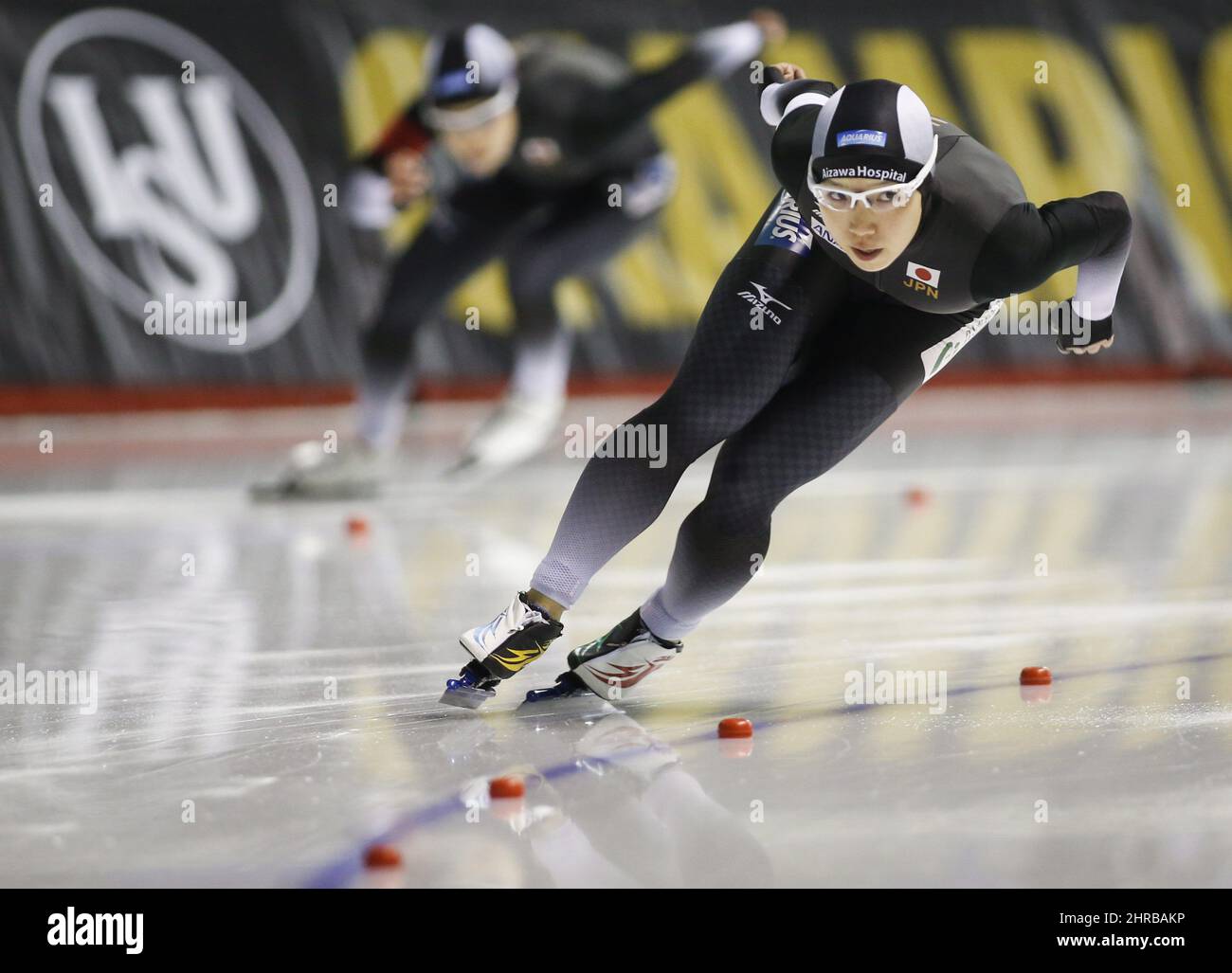 Japan's Nao Kodaira, right, skates with teammate Erina Kamiya during ...