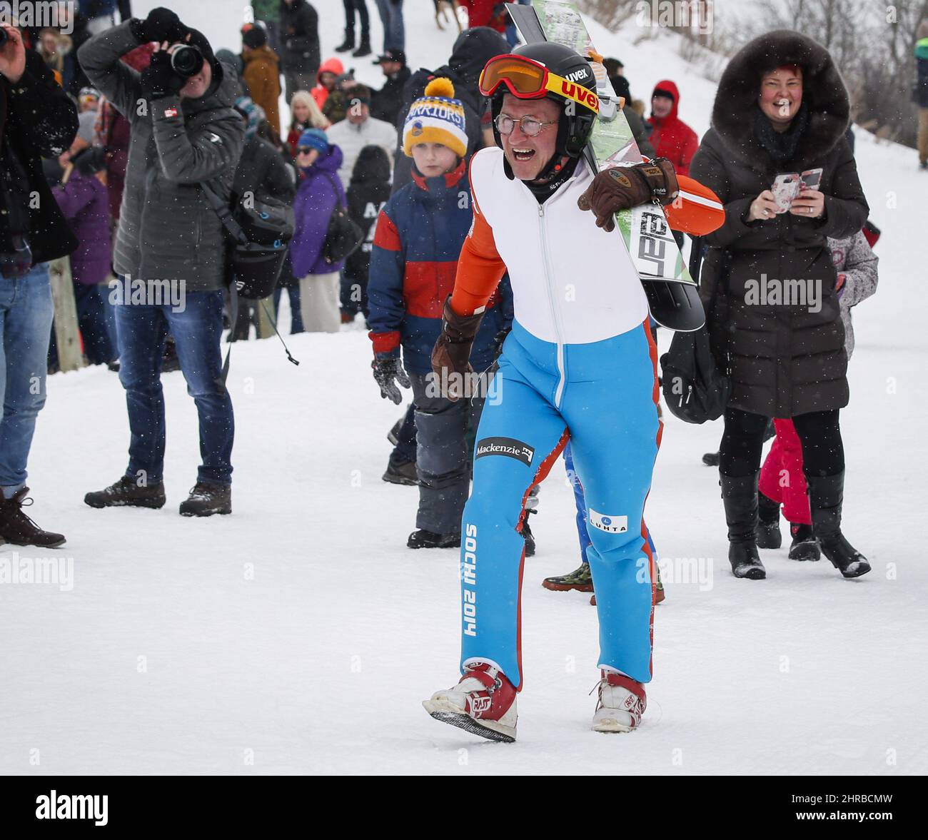 Michael Edwards, best known as "Eddie the Eagle," walks up the hill ...