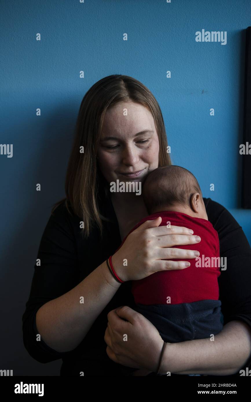 Jessica Wesley holds her two-month-old son Kenneth in her apartment in ...