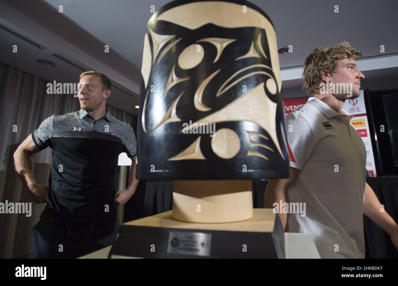 Canada captain Harry Jones, left, and England captain Tom Mitchell walk ...