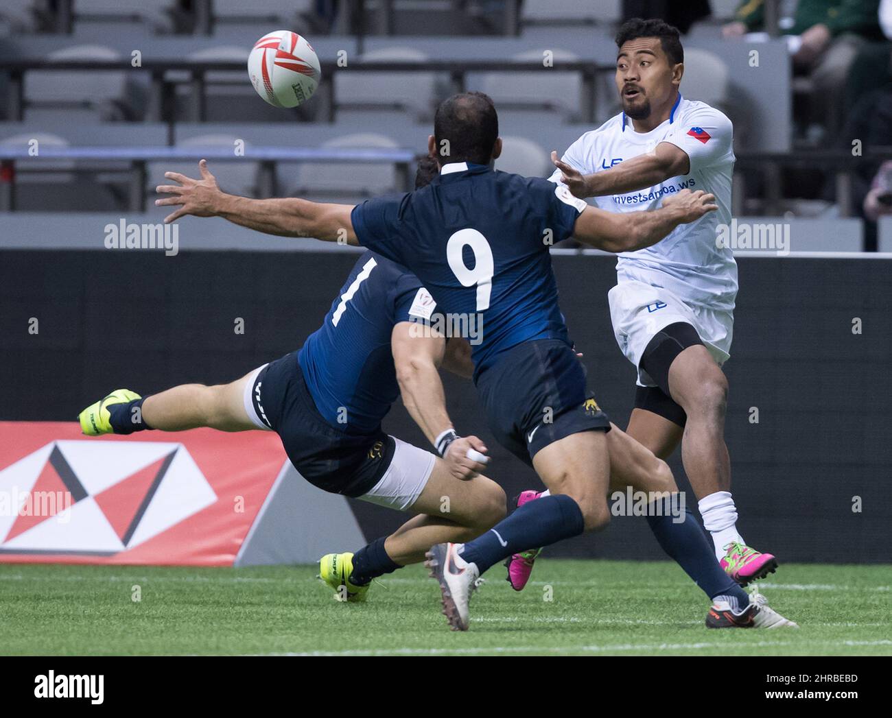 Samoa's Samoa Toloa, right, passes the ball while being pressured by ...