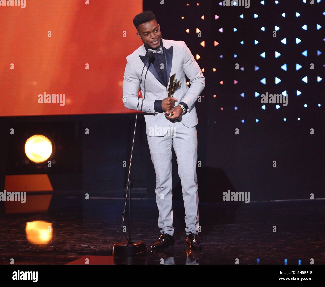 Stephan James accepts the award for Best Performance by an Actor in a ...