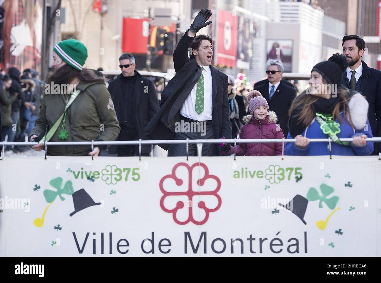 Prime Minister Justin Trudeau waves to the crowd as he walks with his ...