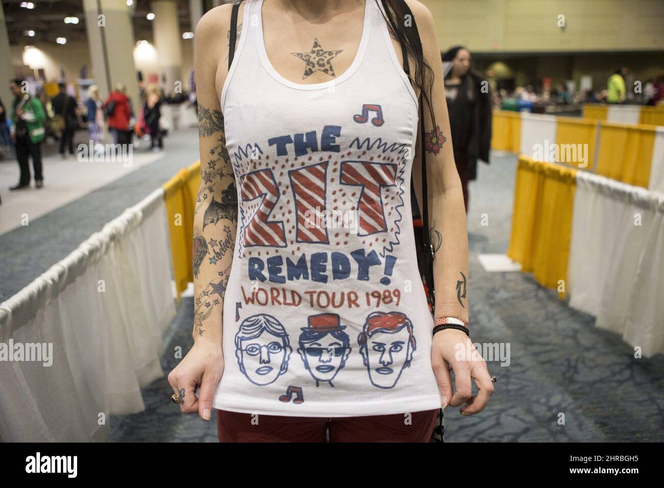 A fan displays a home made "Zit Remedy" band t-shirt as former cast ...