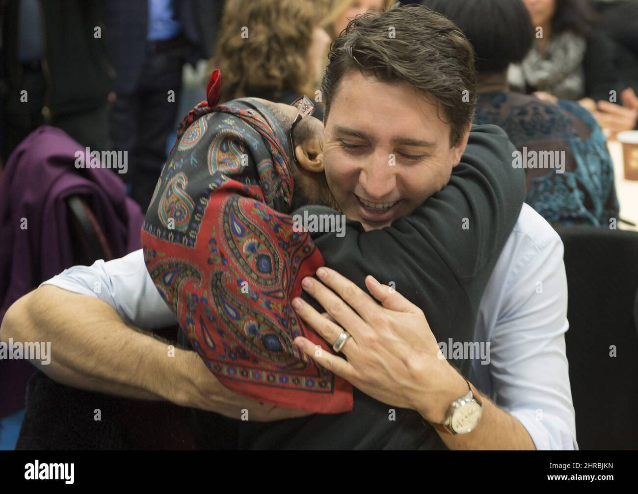 Prime Minister Justin Trudeau gets a hug as he visits caregivers and ...