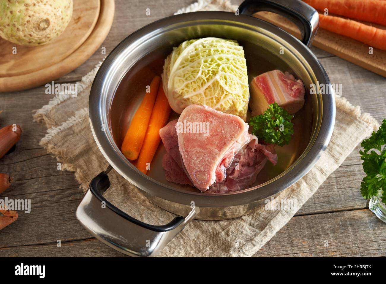 Ingredients for making beef broth or soup in a pot of water - marrow ...