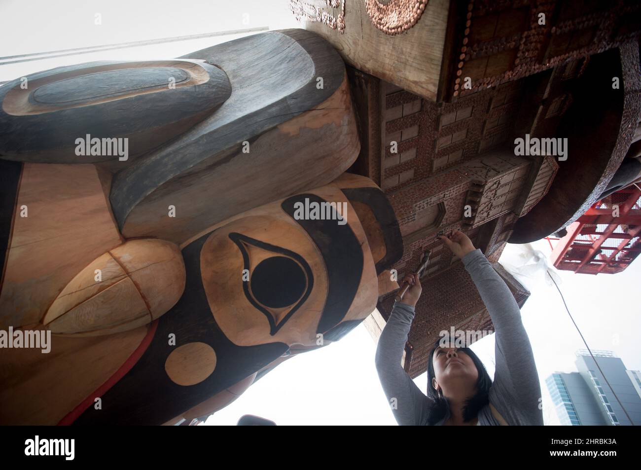 Jocelyn Campbell-Axson, of the Musqueam First Nation, hammers a copper ...