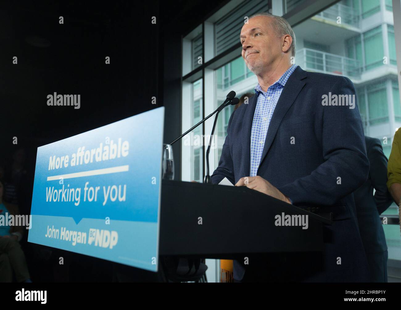 NDP Leader John Horgan pauses while speaking about a credit for renters ...