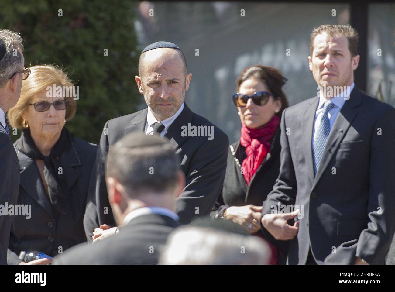 Family members of Dr. Mark Wainberg leave the synagogue following his ...