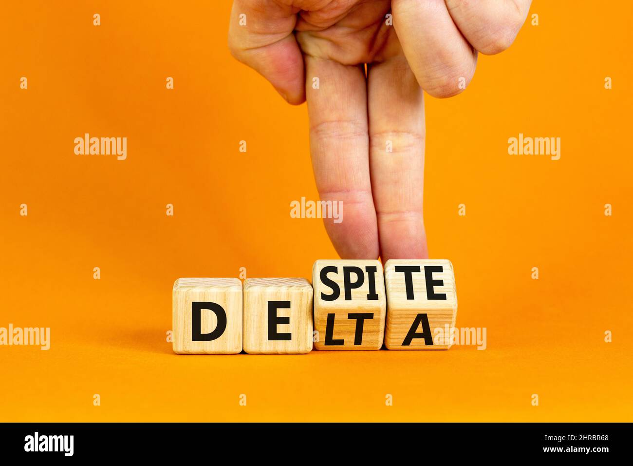 Covid-19 delta variant strain despite symbol. Doctor turns wooden cubes ...