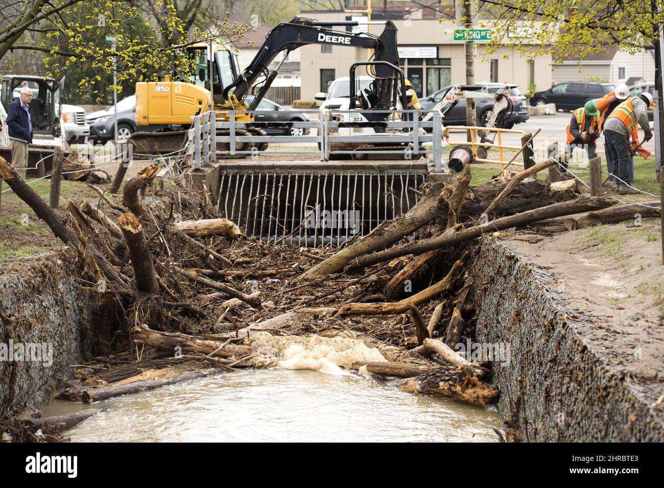 Crews work to clean-up mud and debris in Dundas, Ont., on Friday, April ...
