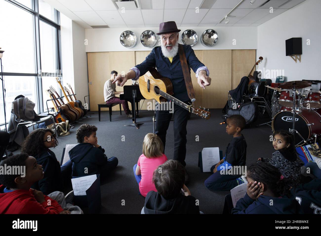 Canadian musician Fred Penner interacts with children as he plays a ...