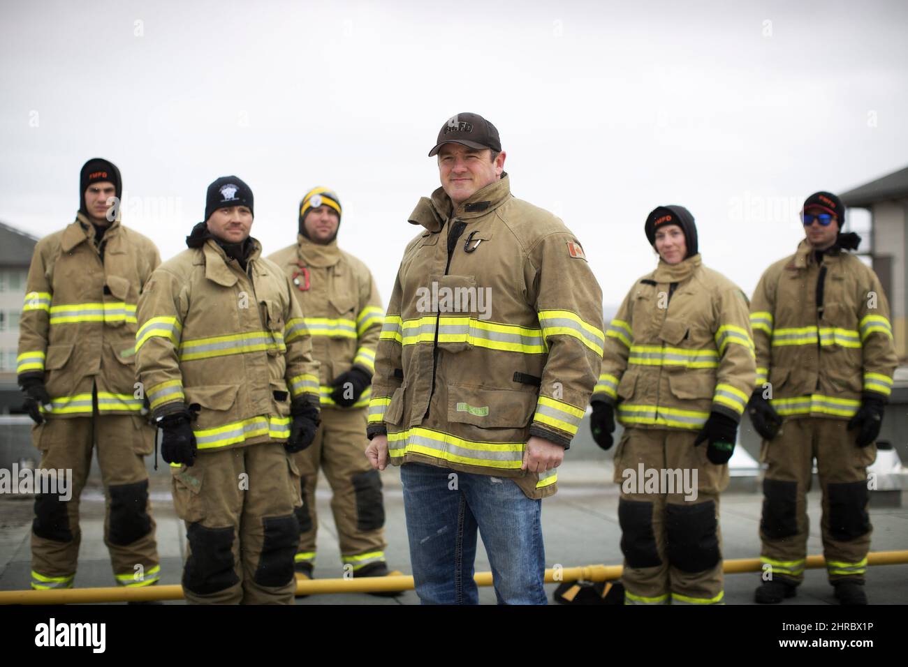 Firefighter Mark Stephenson (C) with fellow firefighters raising money ...
