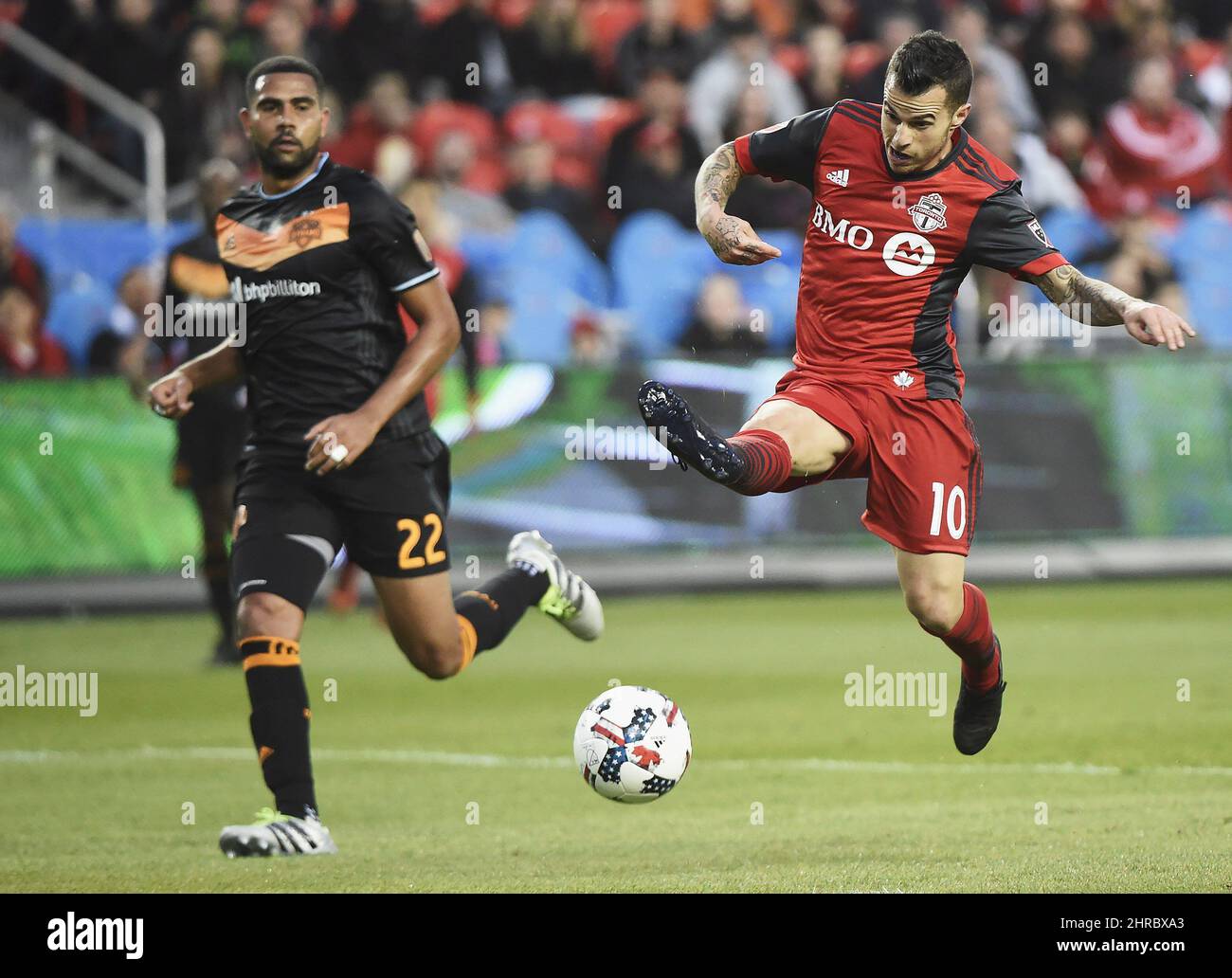 Toronto FC forward Sebastian Giovinco (10) kicks the ball in front of ...