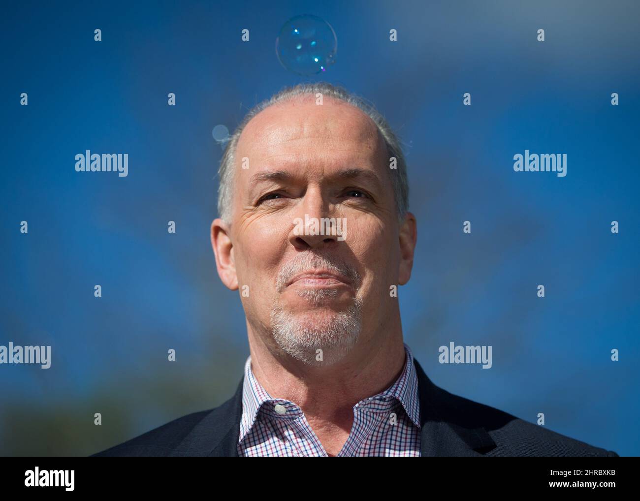 A bubble floats over NDP Leader John Horgan's head as he speaks during ...