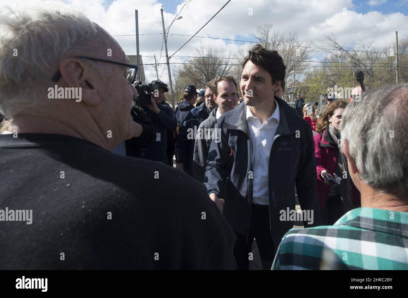 Canadian Prime Minister Justin Trudeau shakes hands with local ...