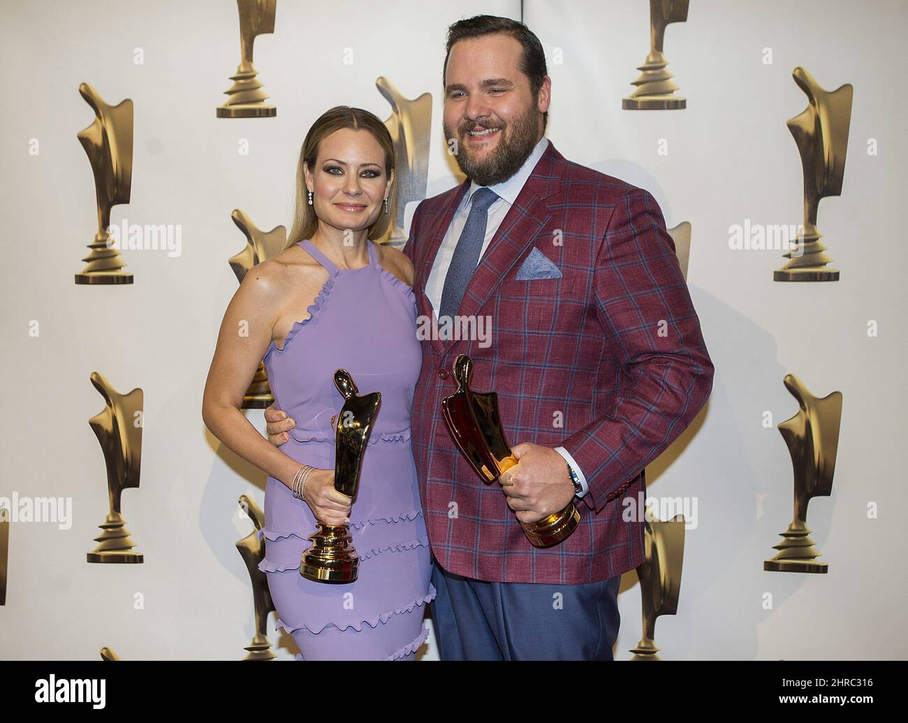 Antoine Bertrand and Catherine-Anne Toupin hold up their awards for ...