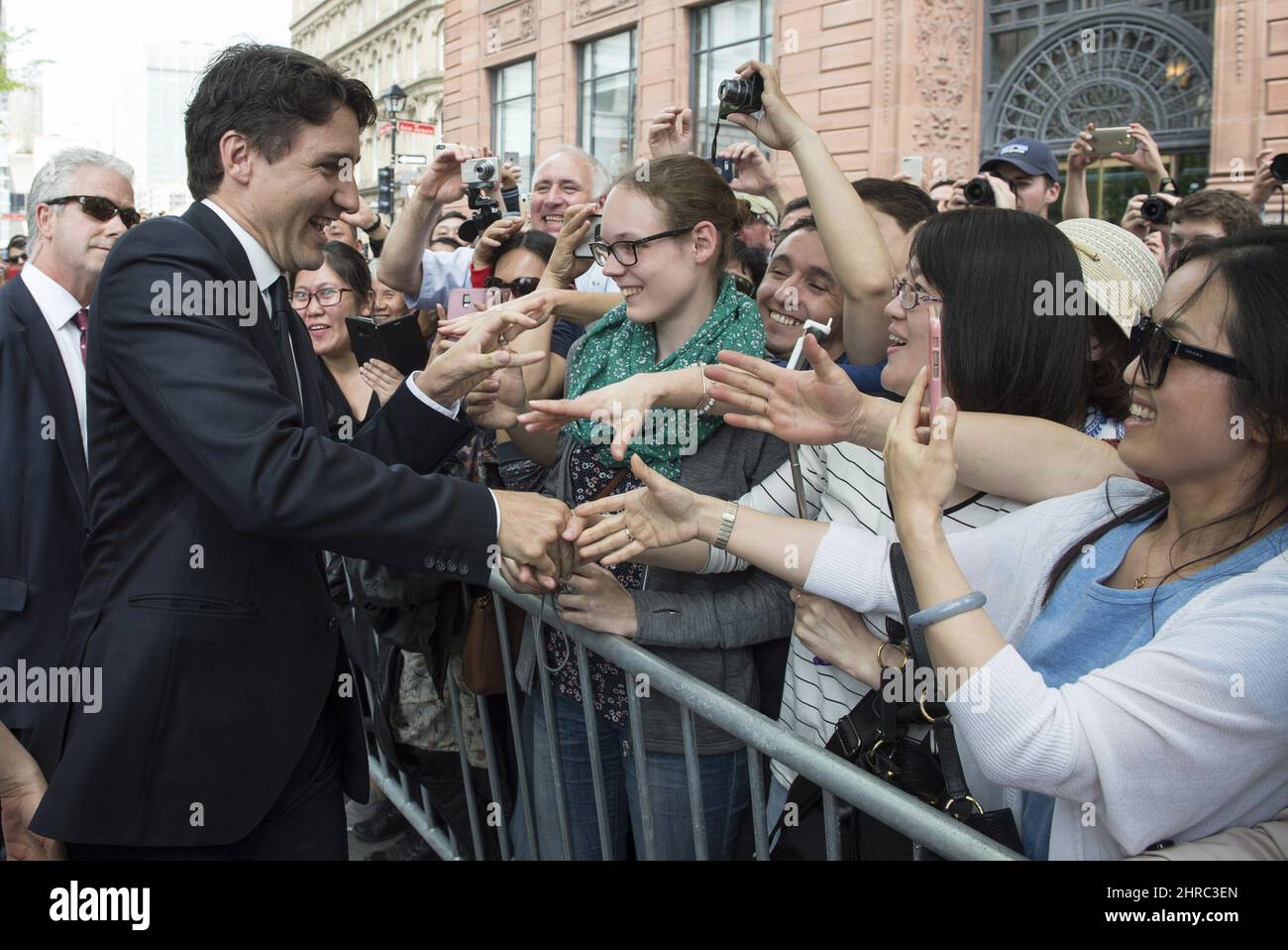 Prime Minister Justin Trudeau greets people during a ceremony marking ...