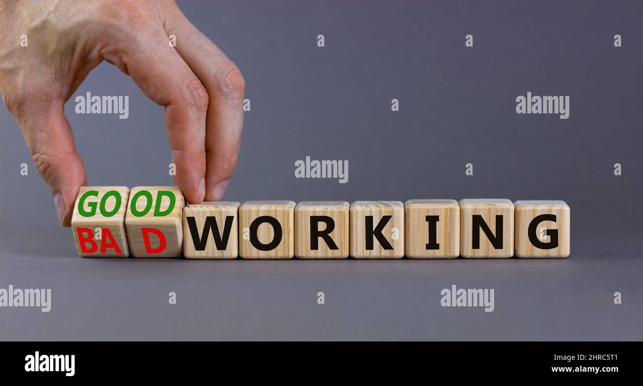 Good or bad working symbol. Businessman turns cubes and changes words ...